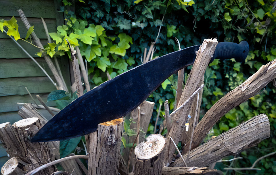 A kukri machete being used to garden. | Knifewarehouse